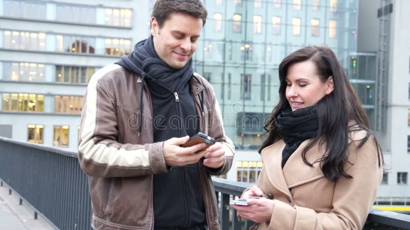 Couple Texting and Talking on Their Cell Phones Stock Video - Video of ...