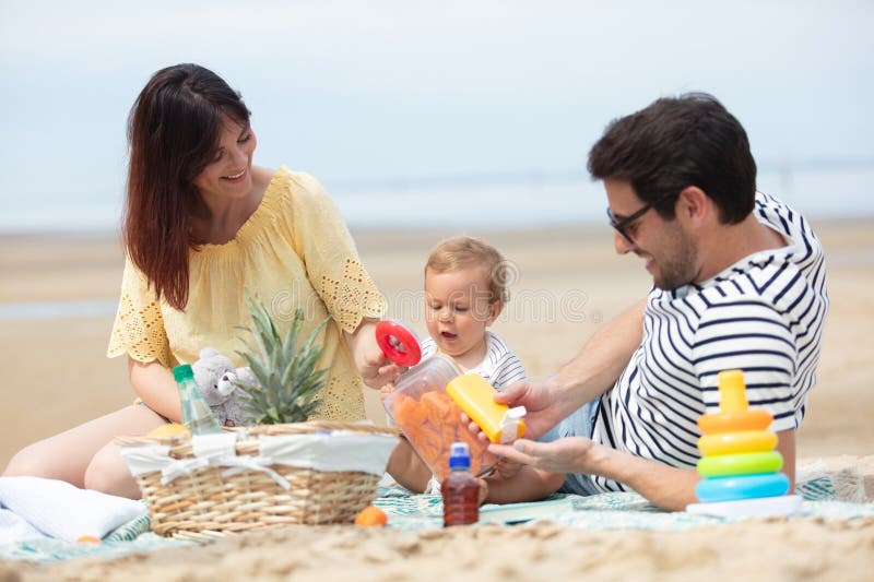 Couple with Their Baby at Sea on Beach Stock Image - Image of journey ...