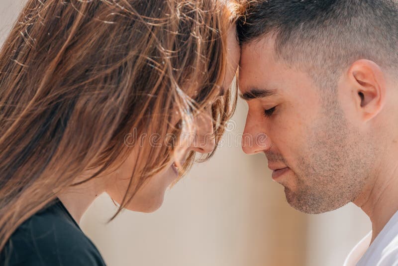 Couple with Their Heads Together Stock Photo - Image of enjoyment ...