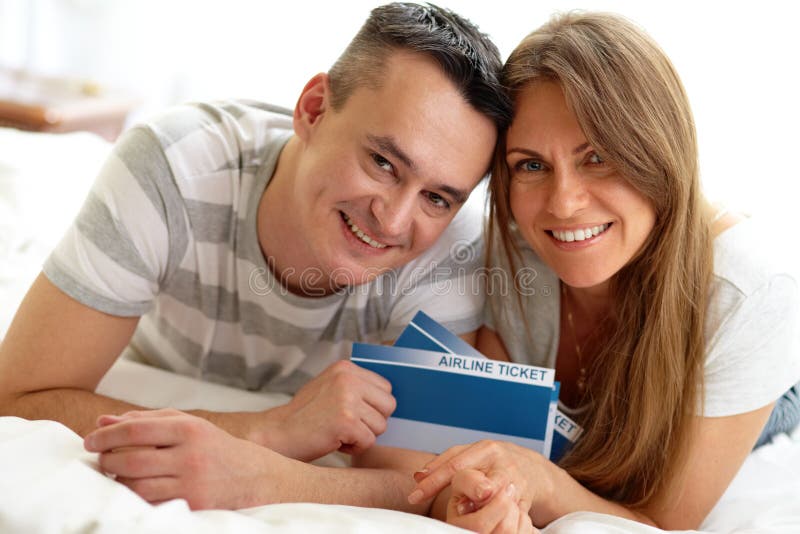 Couple with tickets stock image. Image of airplane, expression - 26268819