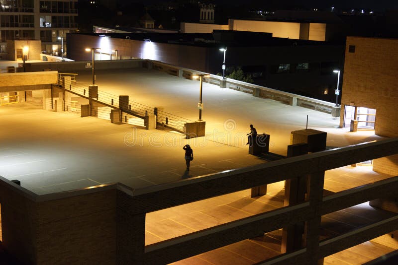 Couple at Empty Parking Ramp Stock Photo - Image of skyscraper ...