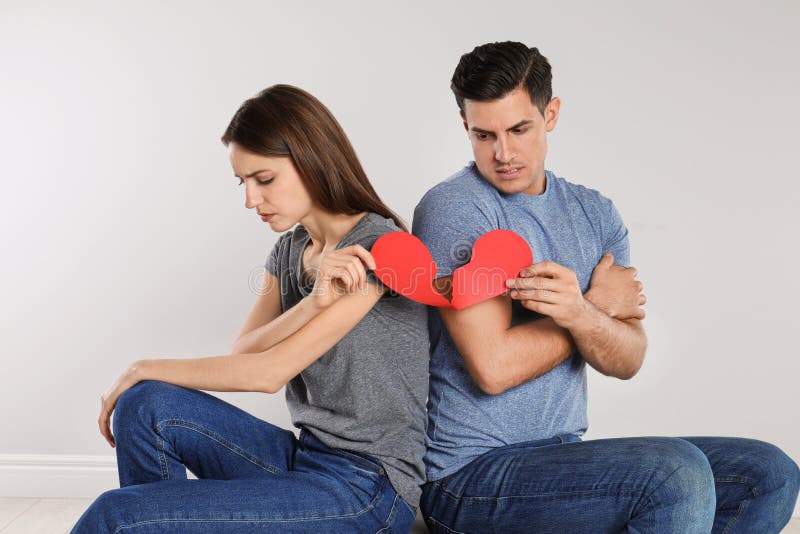 Couple with Torn Paper Heart on Background. Relationship Problems Stock ...