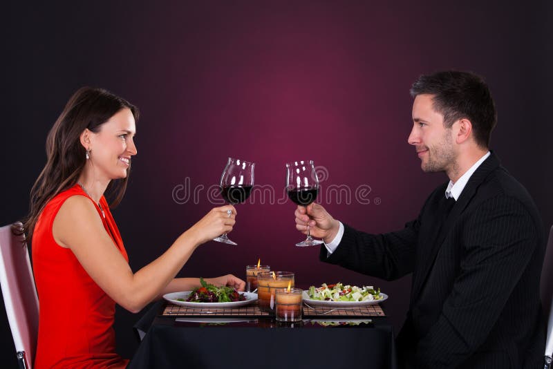 Couple tossing wine glass stock image. Image of dating - 53195673