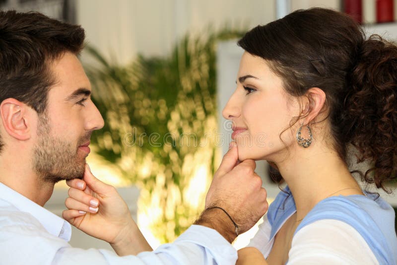 Couple Touching Each Others Faces Stock Image - Image of faces ...