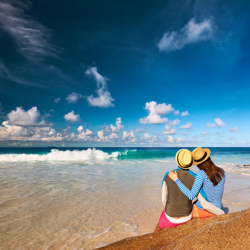 Couple at Tropical Beach Wearing Rash Guard Stock Photo - Image of ...