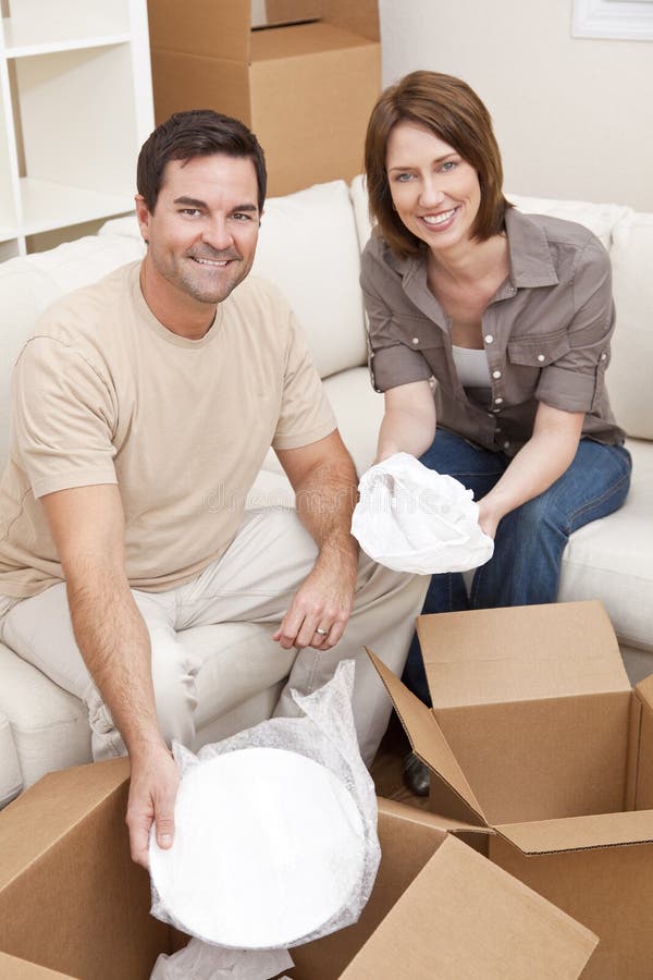 Couple Unpacking or Packing Boxes Moving House Stock Photo - Image of ...