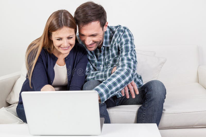 Couple using the computer stock photo. Image of years - 62740346