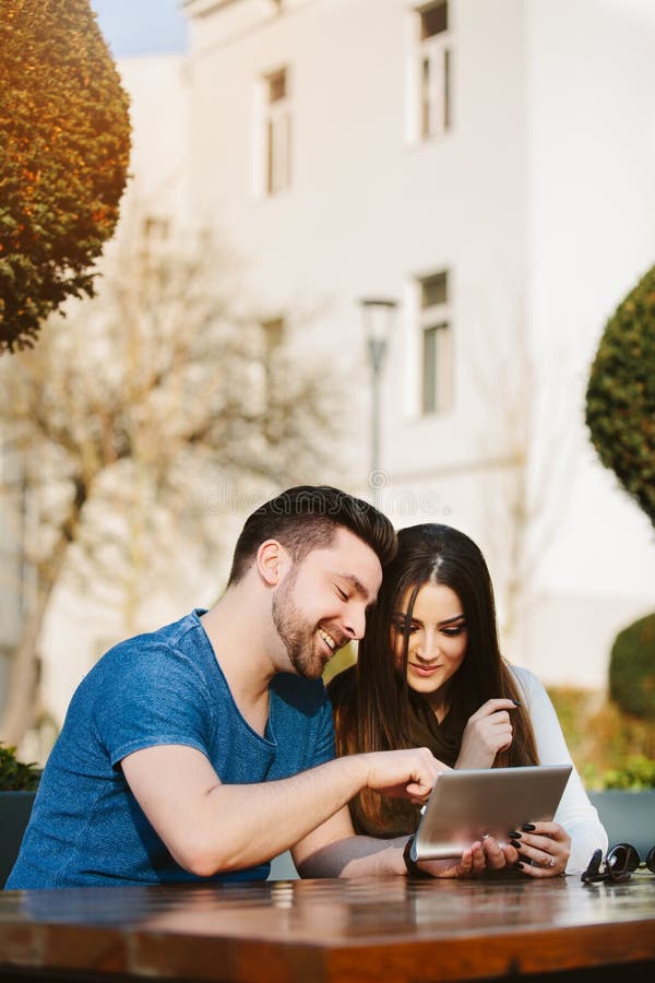 Couple Using Digital Tablet Together Stock Photo - Image of happy ...
