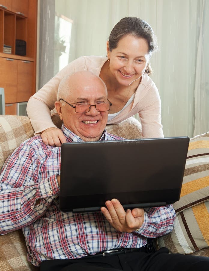 Couple using Internet stock photo. Image of indoors, male - 47303218