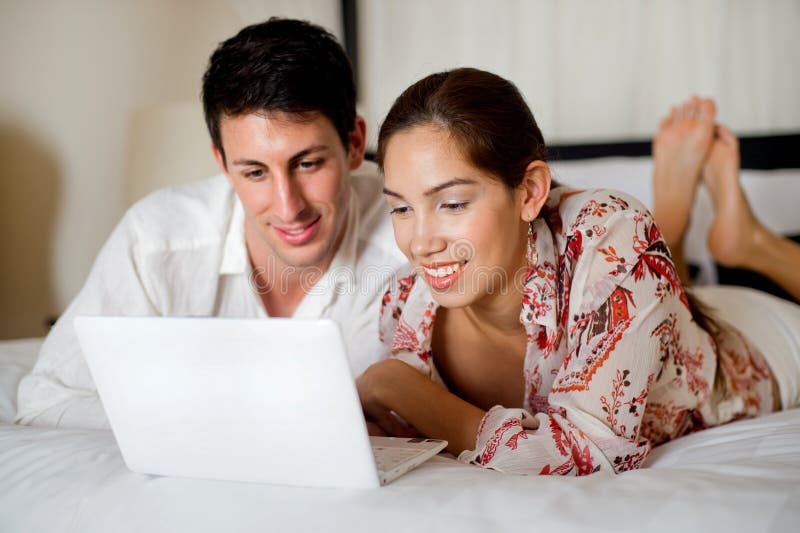 Couple using Laptop stock image. Image of notebook, internet - 771821