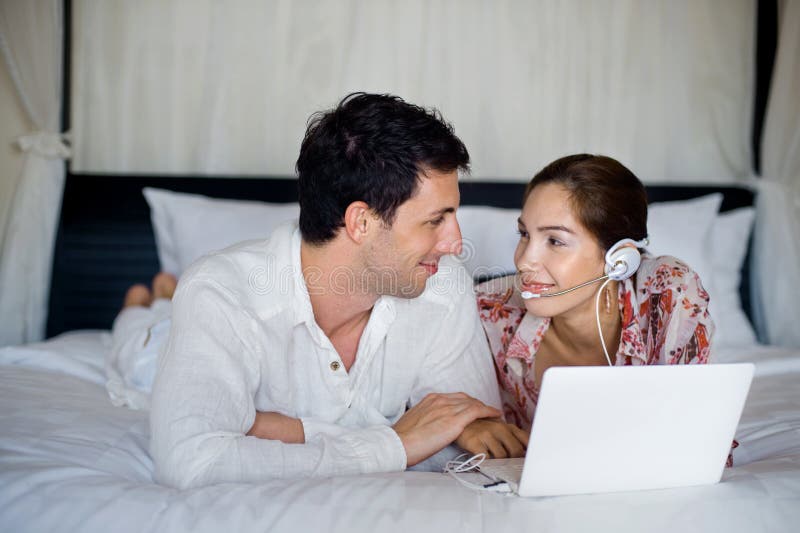 Couple using Laptop stock image. Image of notebook, internet - 771821