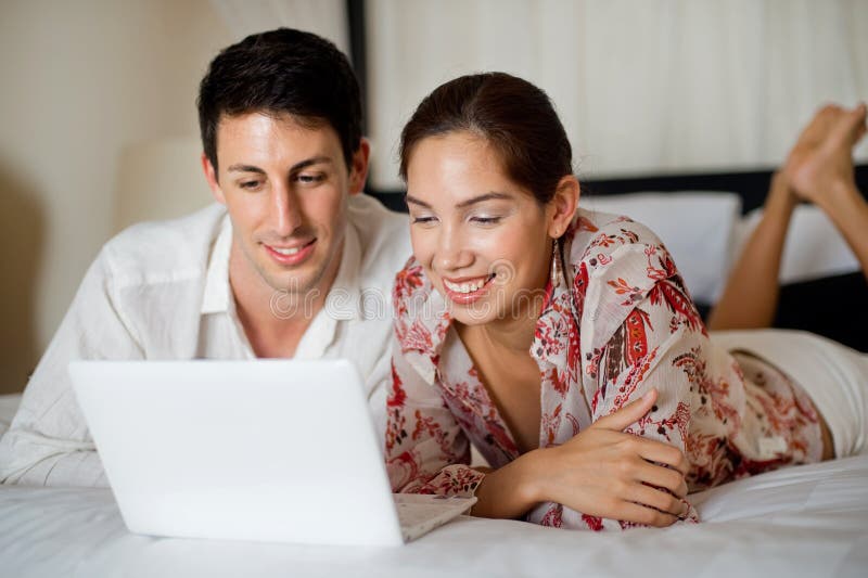 Couple using Laptop stock image. Image of notebook, internet - 771821
