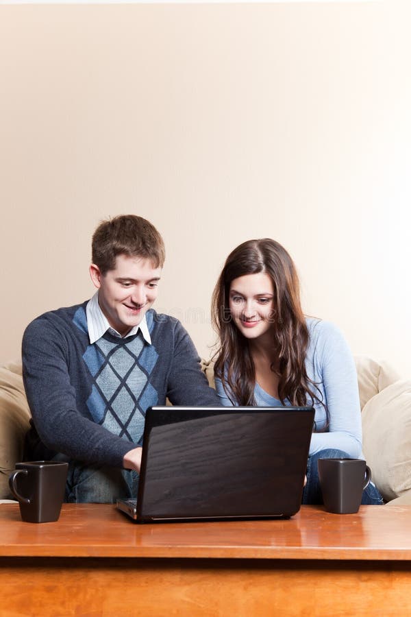 Couple using laptop stock image. Image of couple, laptop - 17370129