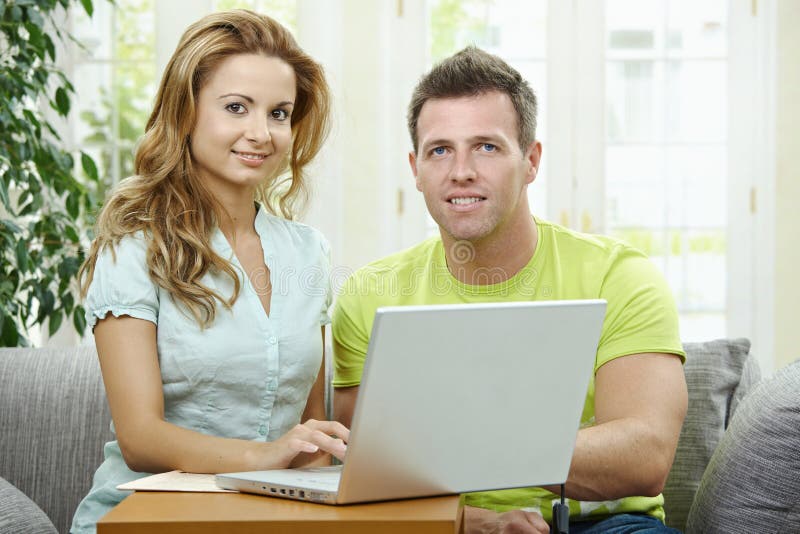 Couple Using Laptop Computer Stock Image - Image of face, holding: 12882995