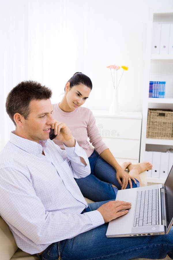 Couple Using Computer at Home Stock Photo - Image of adult, furniture ...