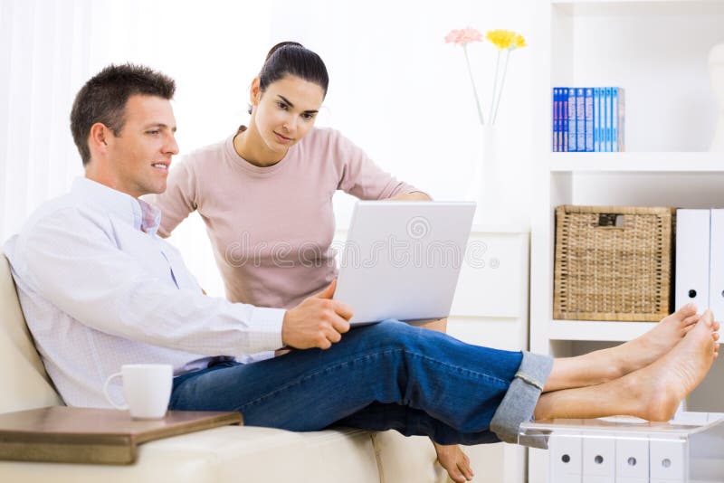 Couple Using Laptop Computer Stock Image - Image of green, hold: 8556175