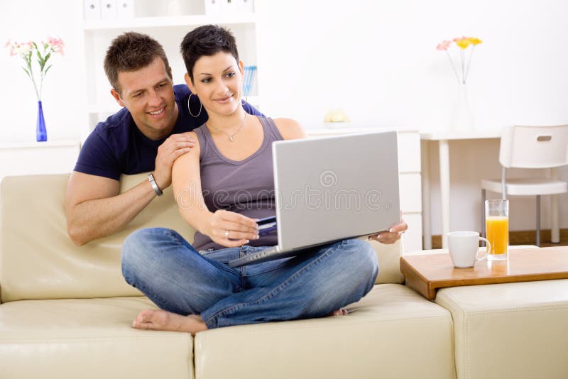 Couple Using Laptop Computer Stock Image - Image of credit, furniture ...