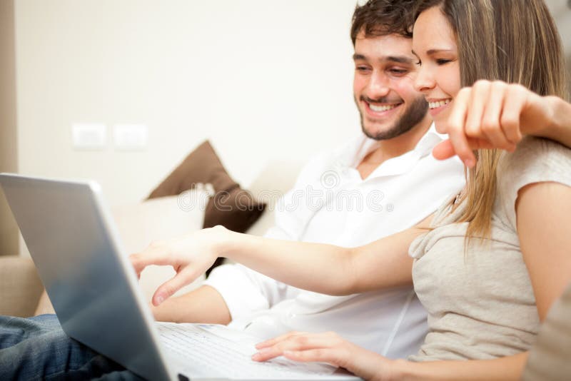Couple Using a Laptop Computer Stock Photo - Image of happiness ...