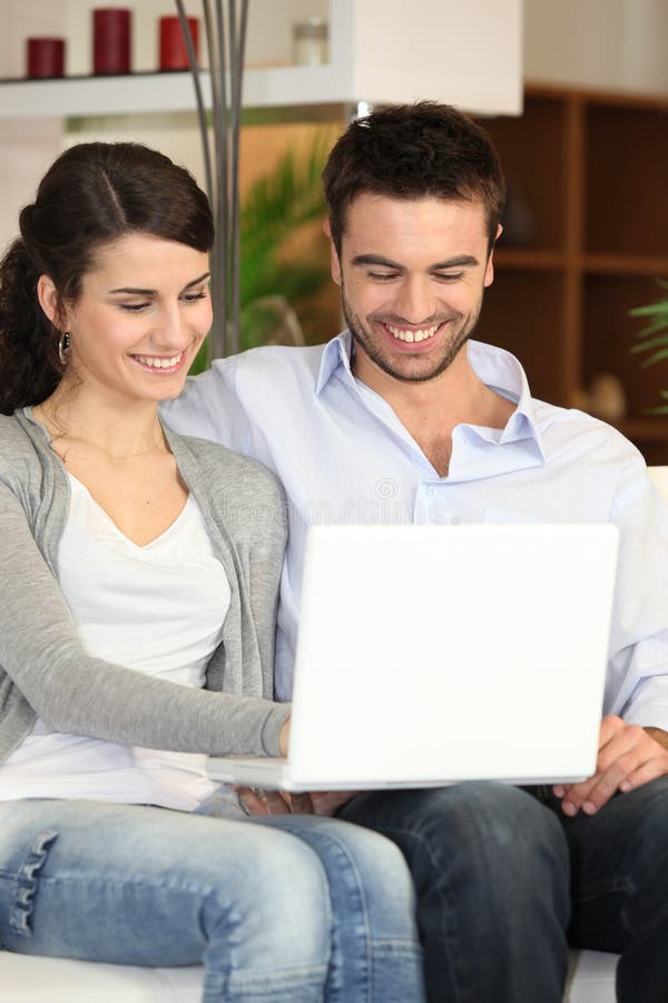 Couple Using a Laptop at Home Stock Photo - Image of technology, email ...