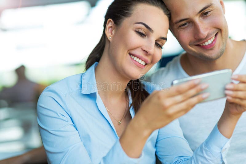 Couple with mobile phone stock image. Image of phone - 32620375