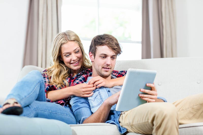 Couple Using Tablet Computer Stock Photo - Image of room, caucasian ...