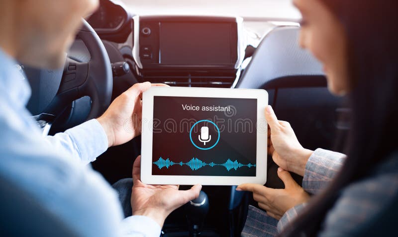 Couple Using Voice Assistant on Tablet Sitting in Car, Back-View Stock ...