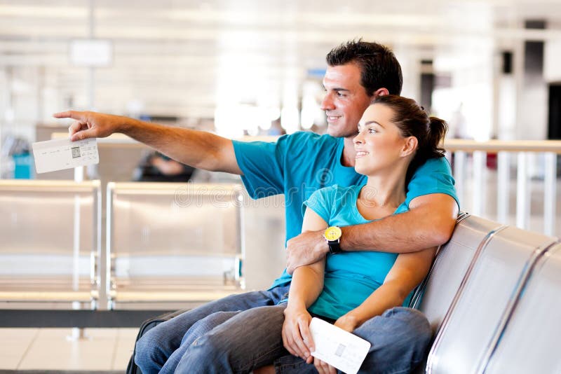 Couple waiting for flight stock image. Image of embrace - 23914365