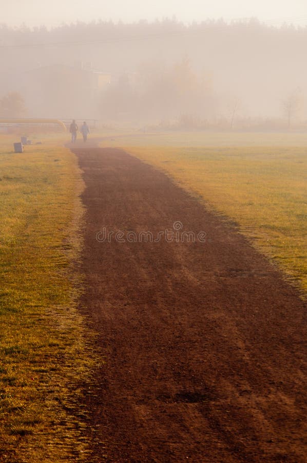 Couple walk in the mist stock image. Image of nature - 22176385
