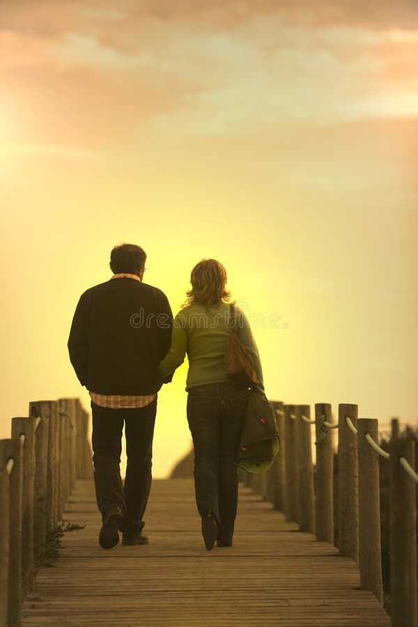 Couple walking stock image. Image of sunset, leisure, walking - 2395879