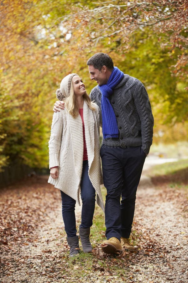 Couple Walking Along Autumn Path Stock Image - Image of countryside ...