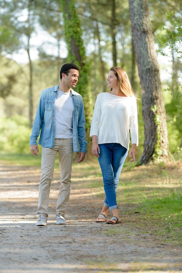 Couple Walking Along Country Path Stock Photo - Image of forest ...