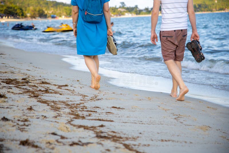 Couple Walking Along the Shore of a Warm Tropical Sea Stock Photo ...