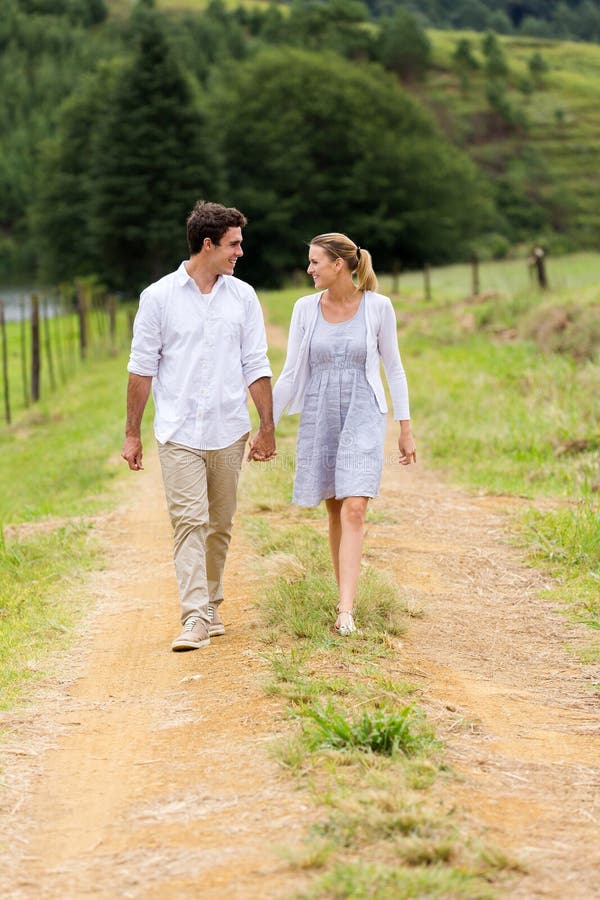 Couple walking countryside stock image. Image of modern - 50963511