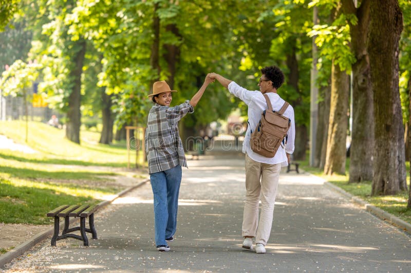 A Couple Walking in the Park and Looking Excited and Enjoyed Stock ...