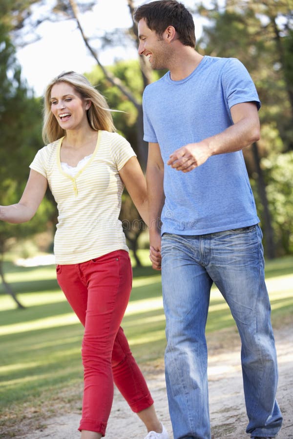 Couple Walking in Park Together Stock Image - Image of outdoors, park ...