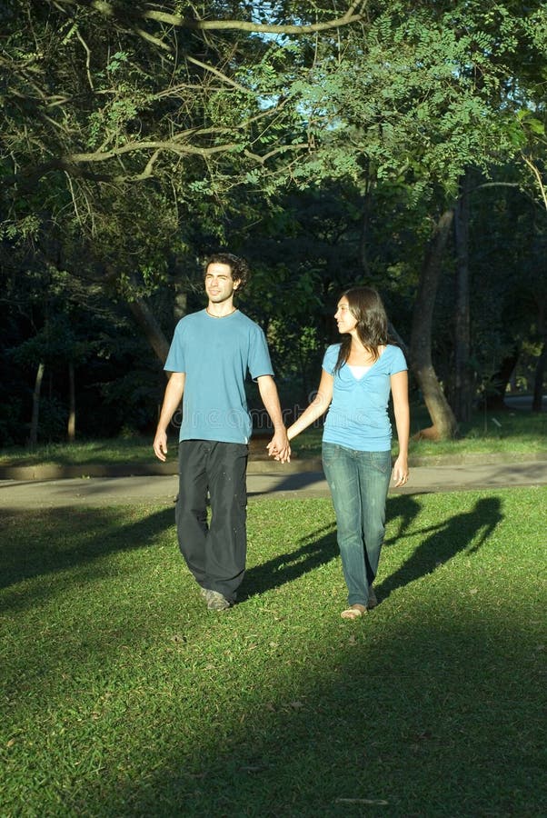 Couple Walking in the Park-Vertical Stock Photo - Image of park, female ...