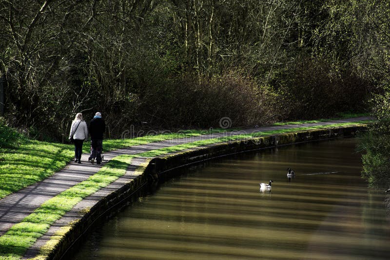 Couple Walking on Path Near Canal in Spring. Stock Image - Image of ...