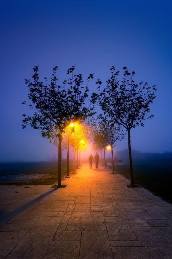 Couple Walking on Path at Night Stock Photo - Image of evening, street ...