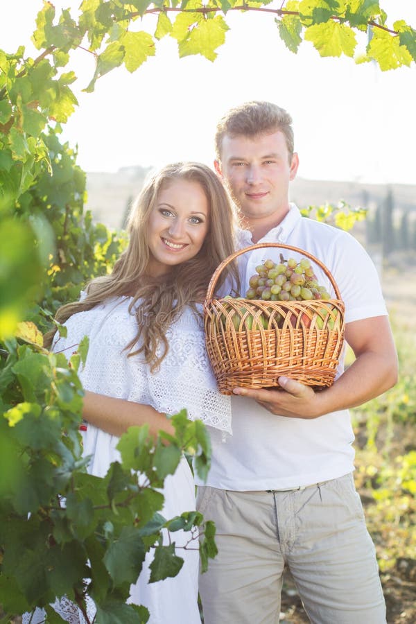 Couple Walking in between Rows of Vines Stock Image - Image of ...