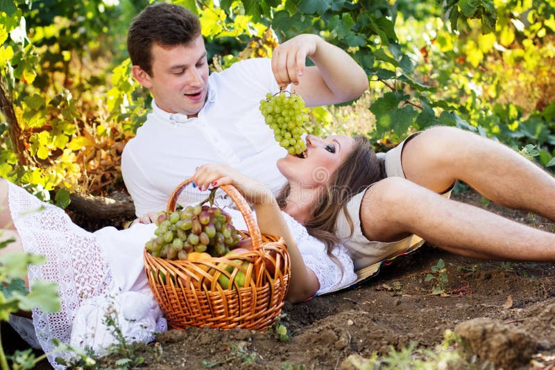 Couple Walking in between Rows of Vines Stock Photo - Image of girl ...