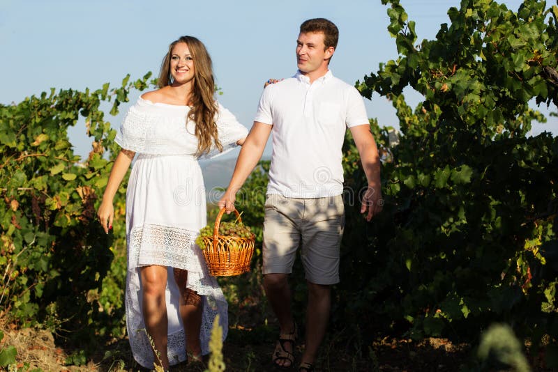 Couple Walking in between Rows of Vines Stock Image - Image of ...