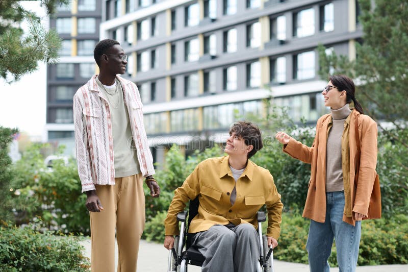 Couple Walking with Their Friend with Disability Stock Image - Image of ...