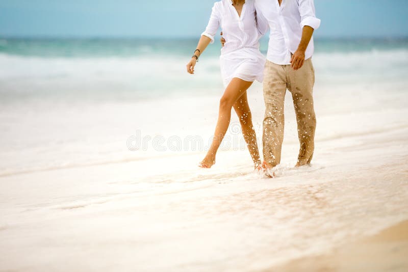 Couple Walking through the Waves Stock Image - Image of beautiful ...