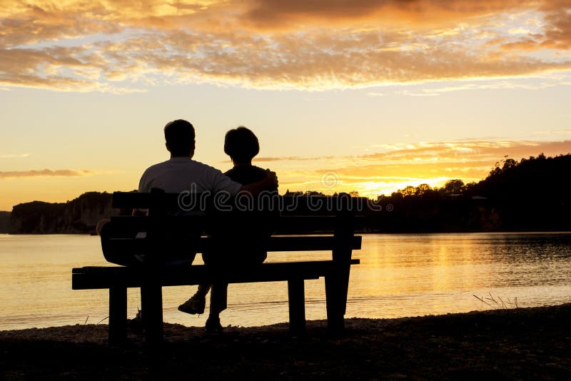 Couple Watching a Beautiful Sunset Together Stock Photo - Image of ...