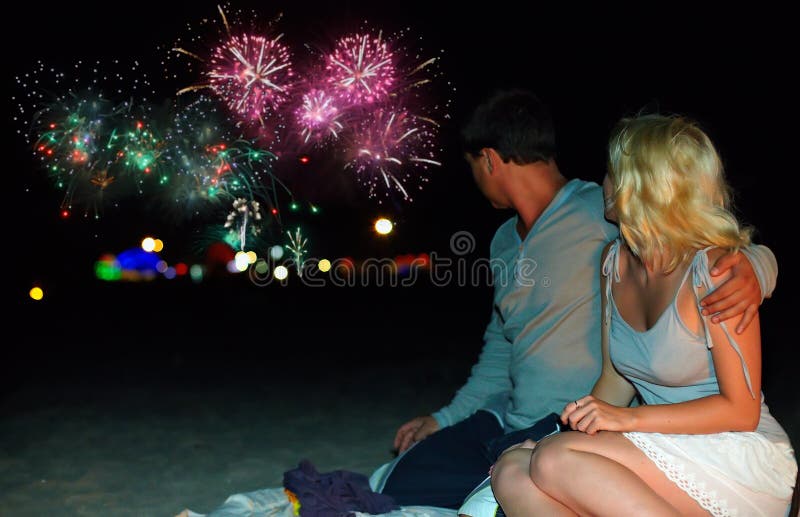 Couple Watching Colorful Fireworks at the Beach Stock Image - Image of ...