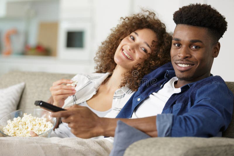 Couple Watching Movies on Sofa Stock Photo - Image of togetherness ...