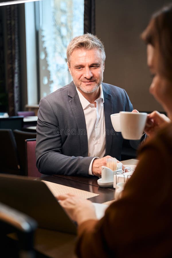 Couple Watching Something on Laptop during Coffee Time Stock Image ...