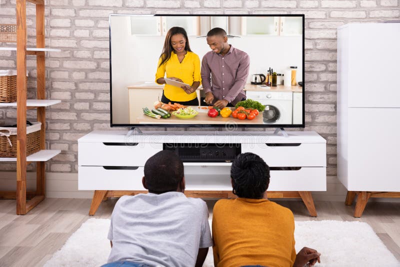 Couple Watching Television at Home Stock Photo - Image of adult ...