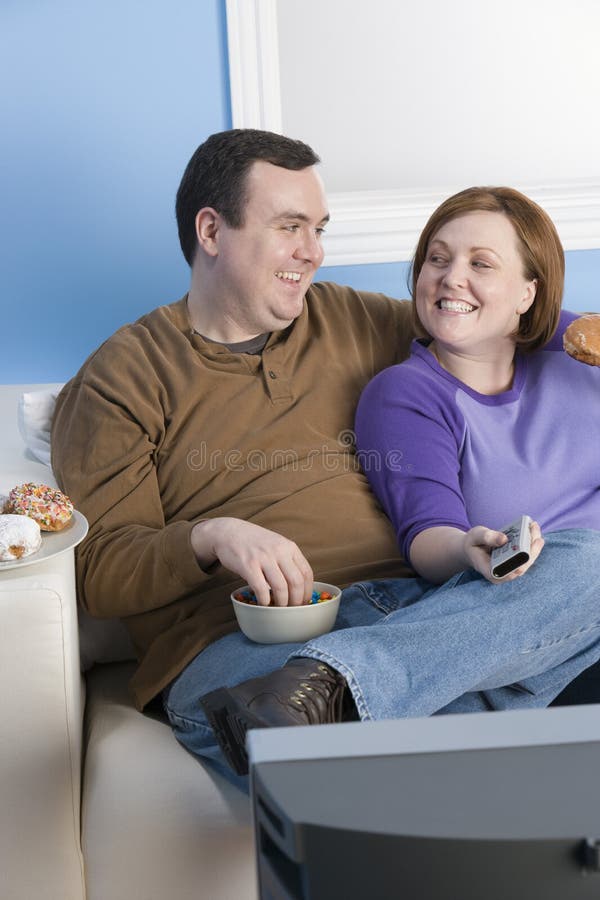 Couple Watching Television Together Stock Photo - Image of donut, room ...