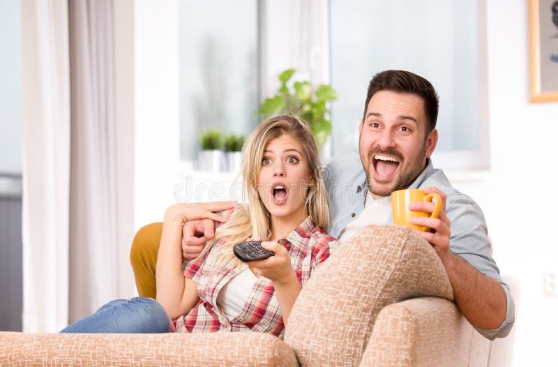 Couple Watching Tv and Feeling Excited Stock Photo - Image of couple ...